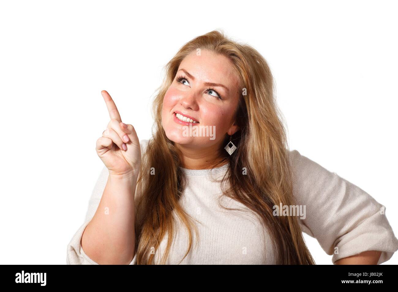 Portrait of young woman looking upwards on a white background Stock ...