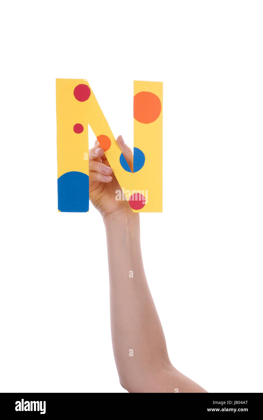 A Hand Holding a Colorful N, Isolated Stock Photo - Alamy