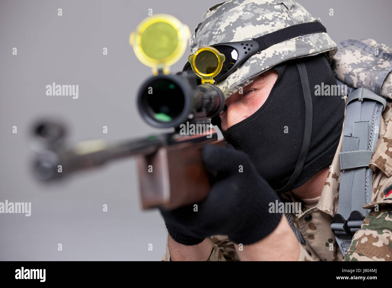 Sniper aiming and shooting - military scene making in a studio Stock ...
