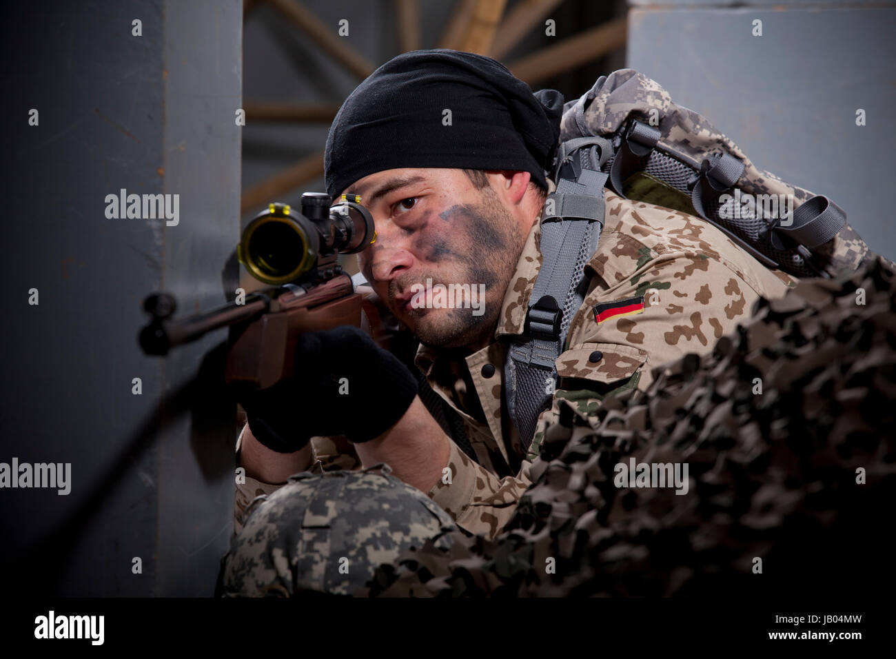 Military man holding weapon making hi-res stock photography and images ...