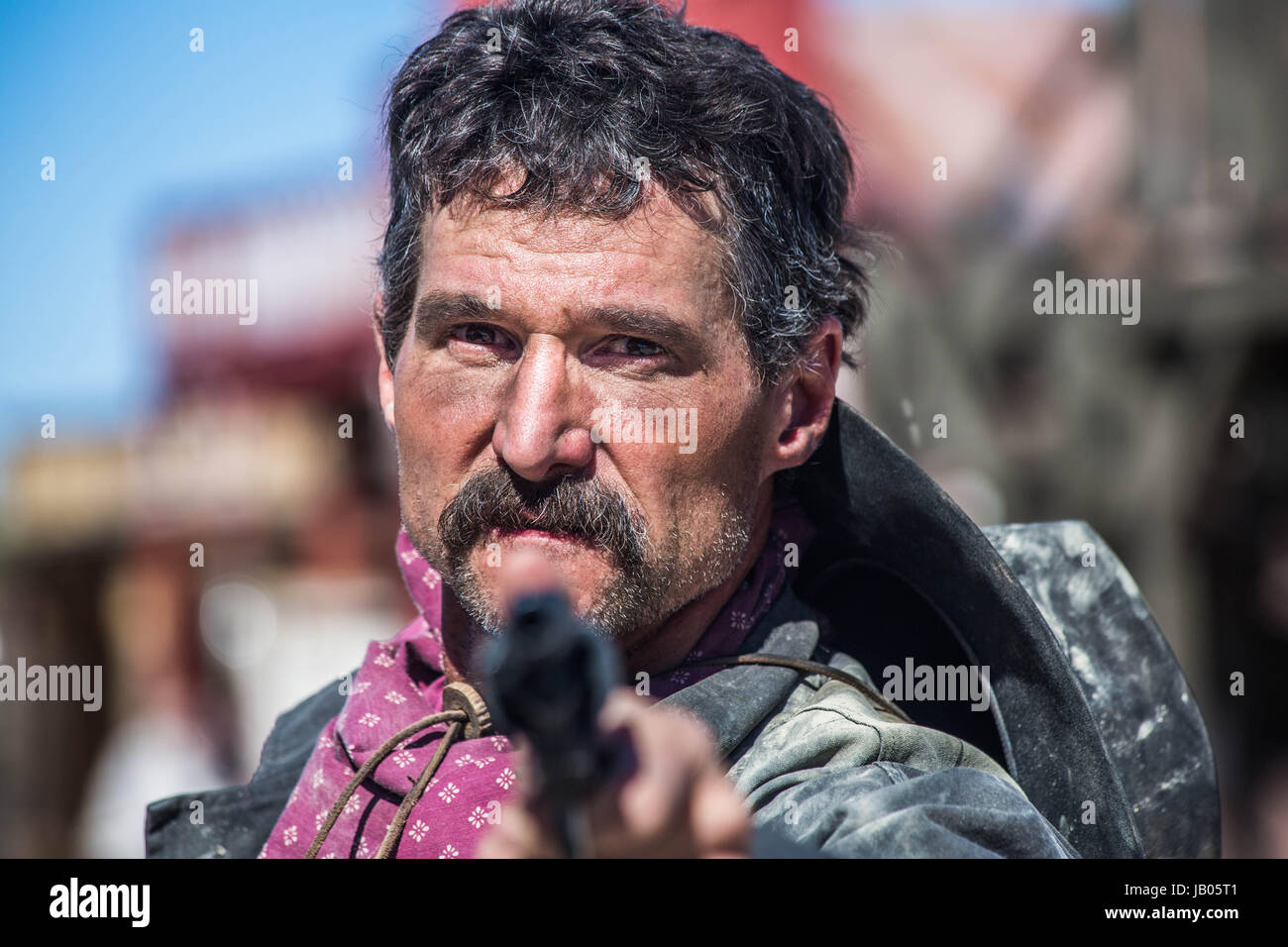 Serious Cowboy Points Gun at You Stock Photo - Alamy