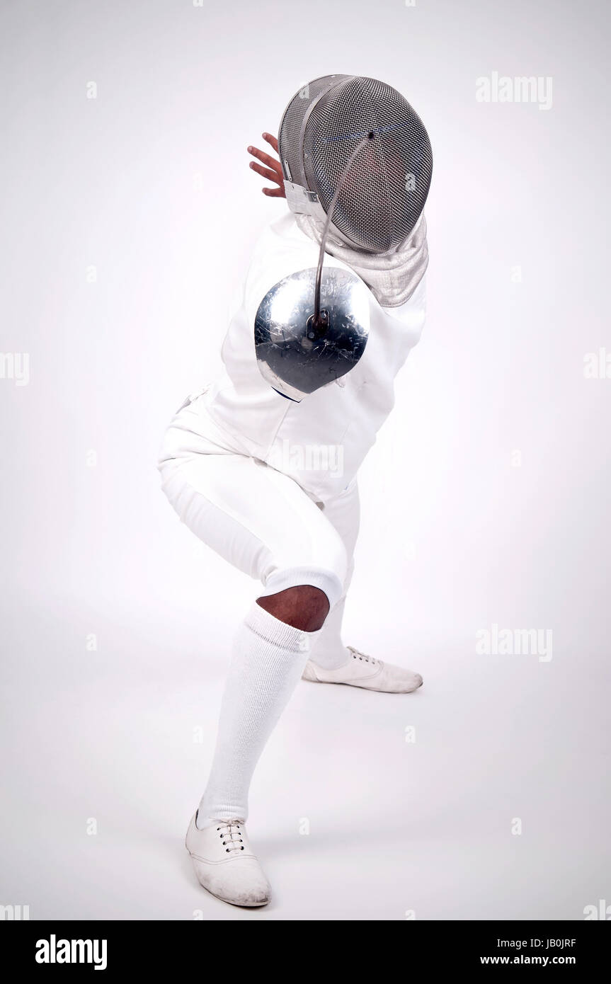 Male fencer isolated in a light background Stock Photo - Alamy
