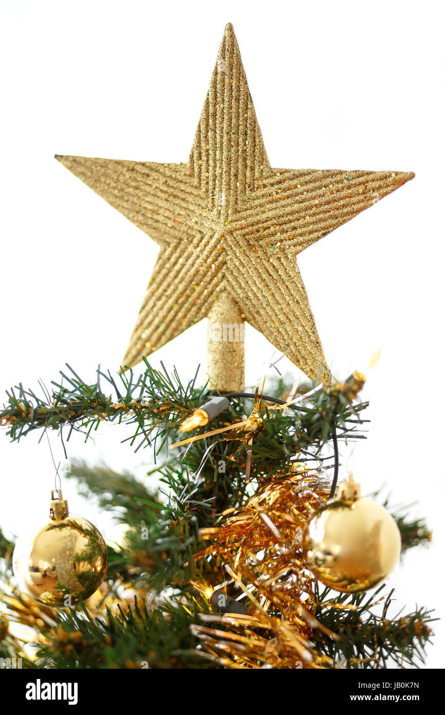 Decorated christmas tree with yellow and green balls on white ...