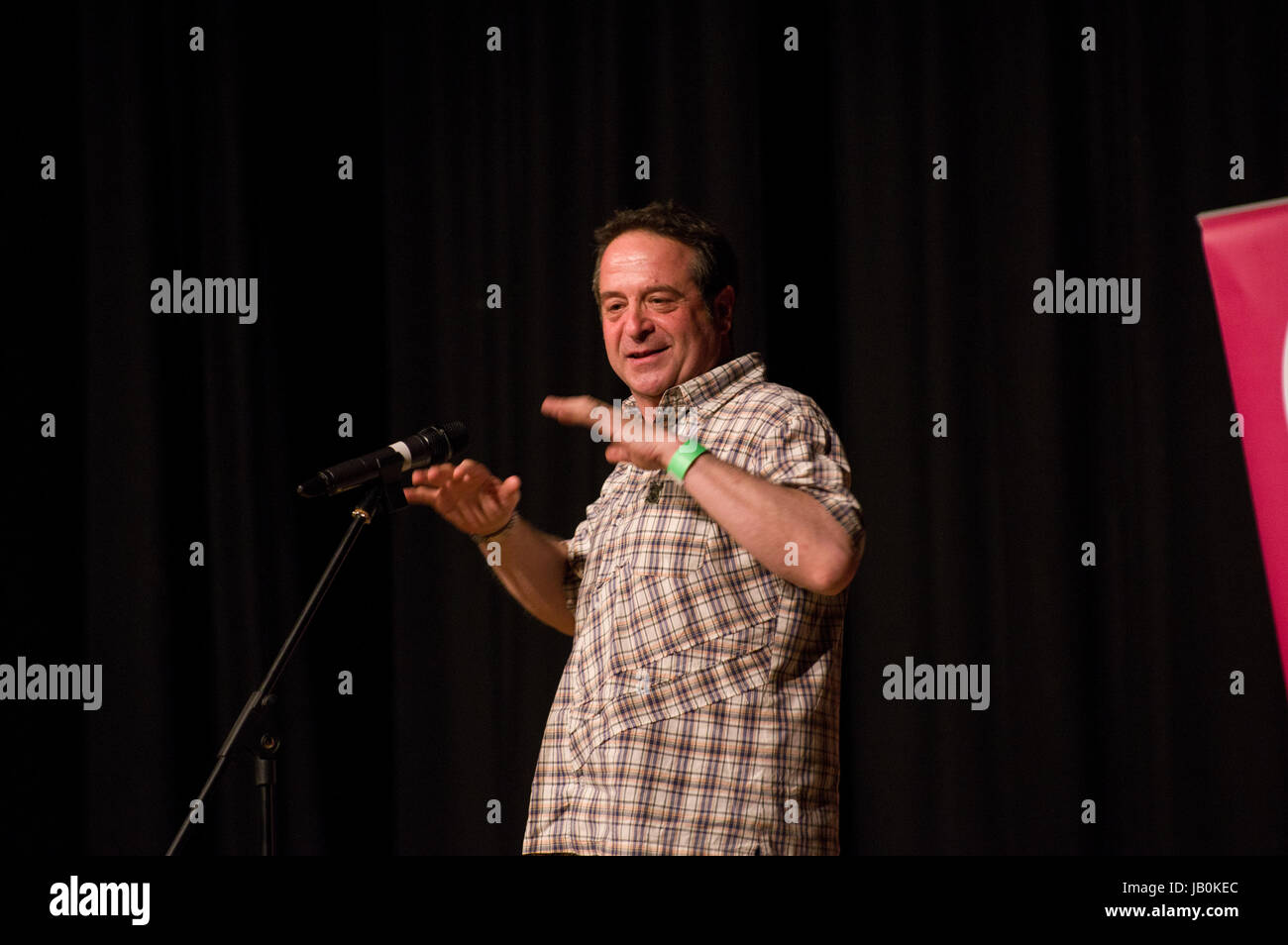 Comedian Mark Thomas speaking in the Town Hall at the 2017 Stoke ...