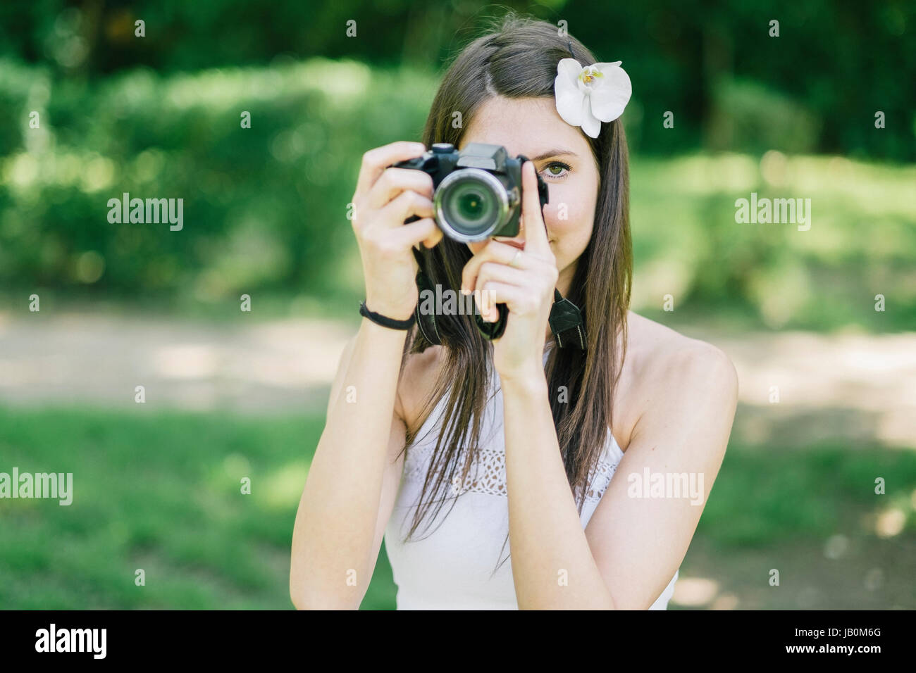 Woman with a camera Stock Photo - Alamy