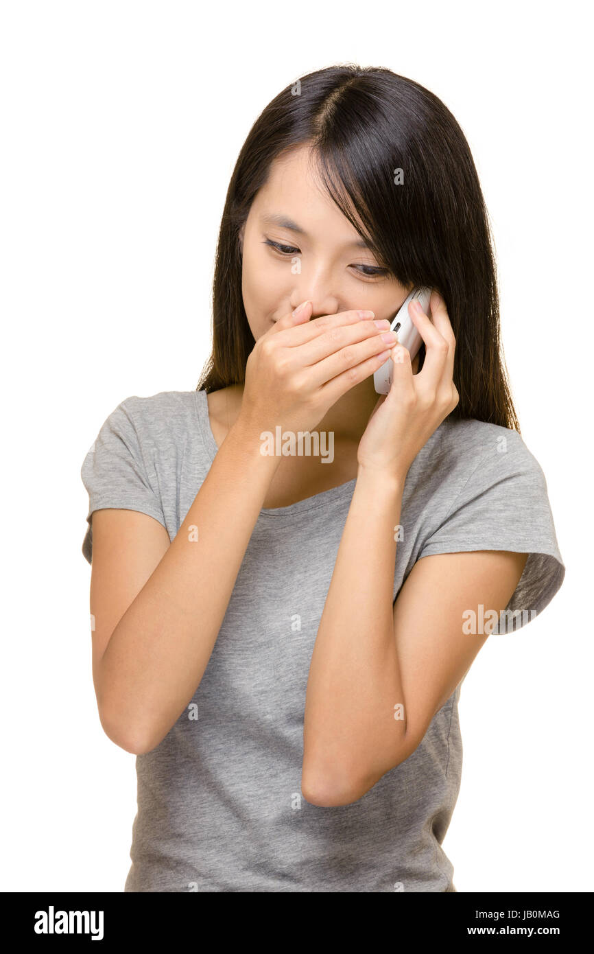 Asian woman talk to phone secretly Stock Photo - Alamy