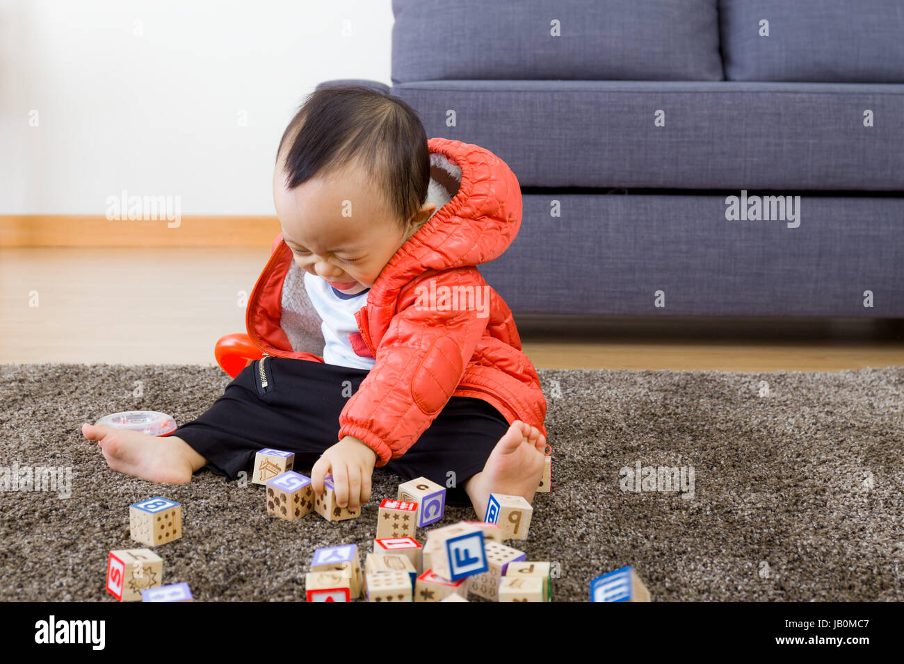 Baby play with toy block at home Stock Photo - Alamy