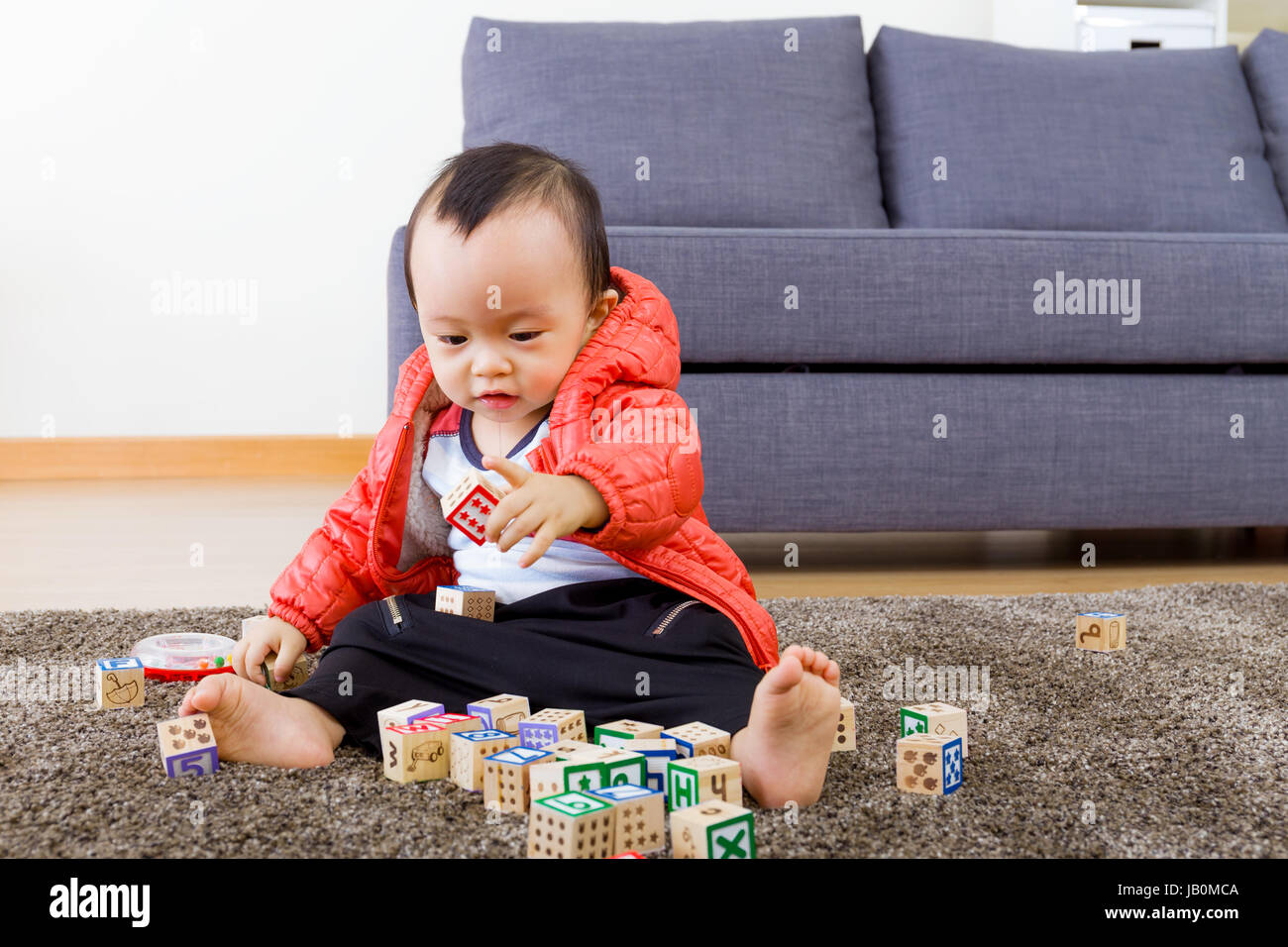 Asian baby playing wooden block Stock Photo - Alamy