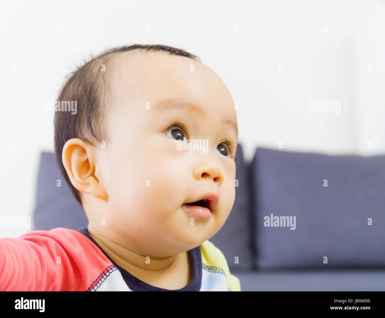 Little baby looking up Stock Photo - Alamy