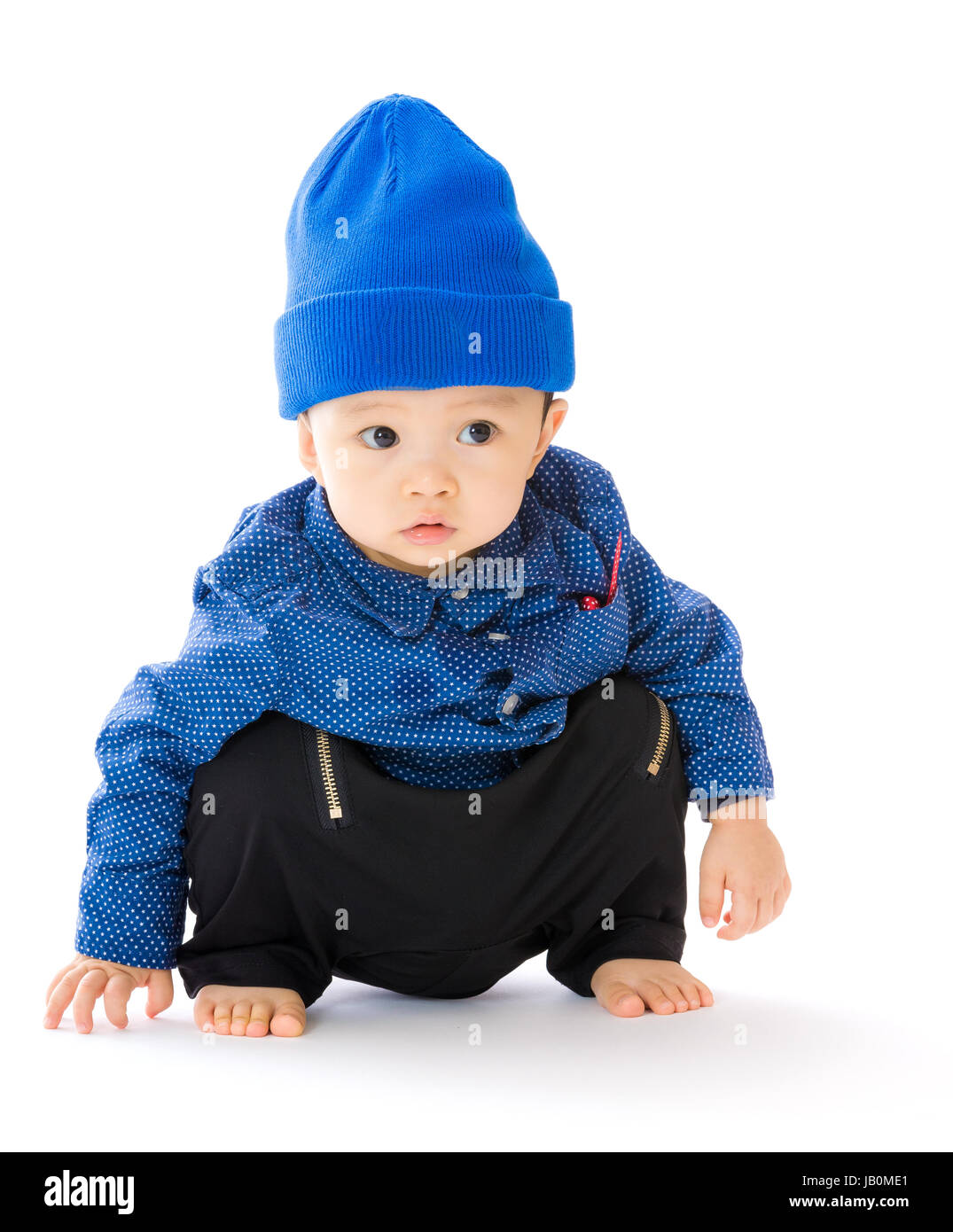 Asian baby crouching on floor Stock Photo - Alamy
