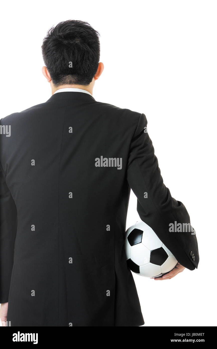 Rear view of businessman with soccer ball Stock Photo - Alamy