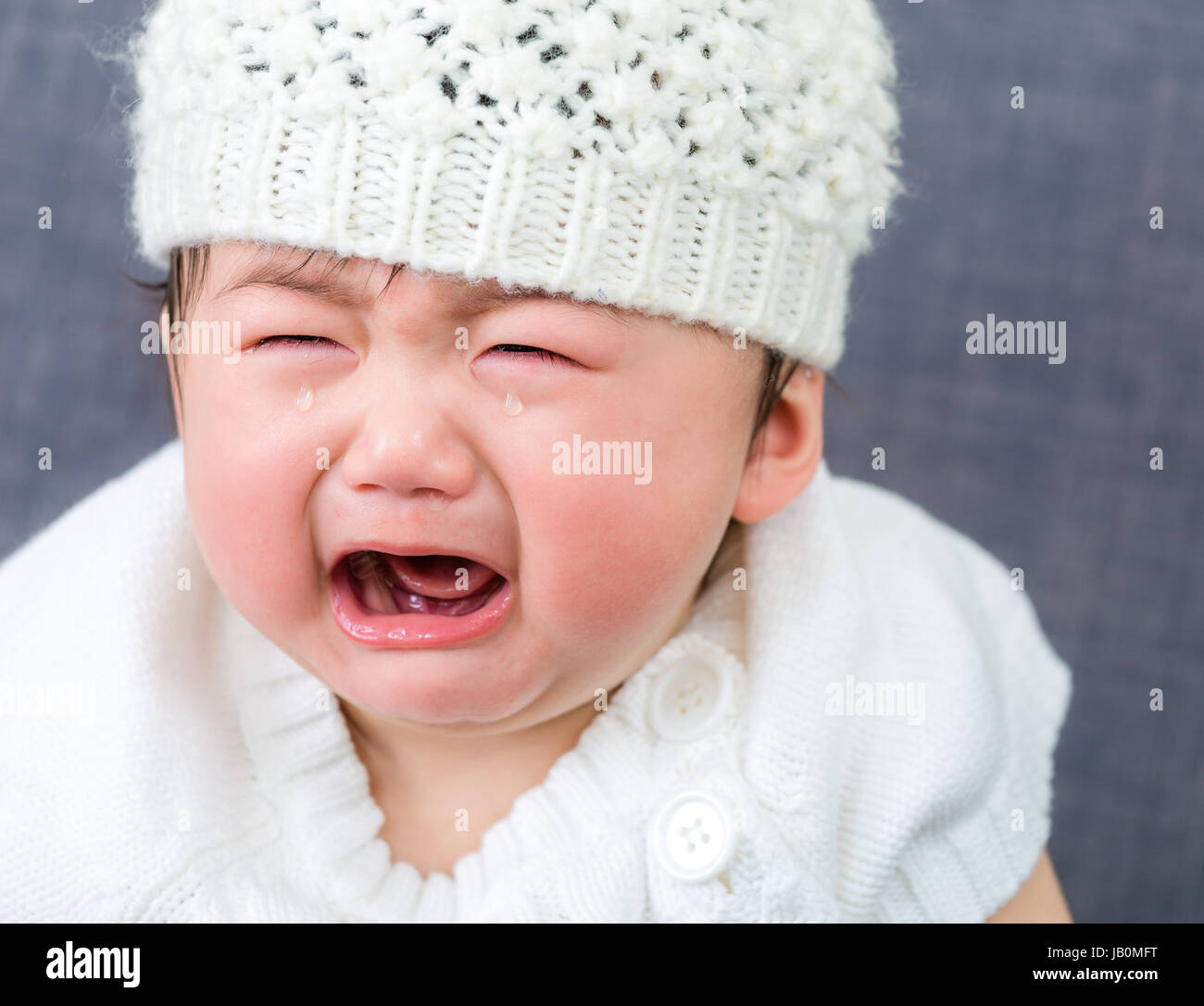 Asian baby crying Stock Photo - Alamy