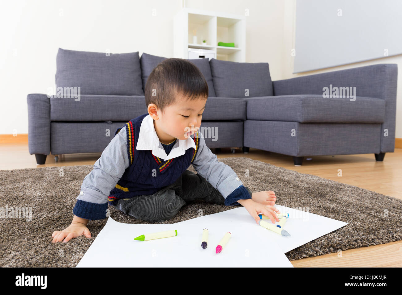 Asian baby boy drawing picture Stock Photo - Alamy