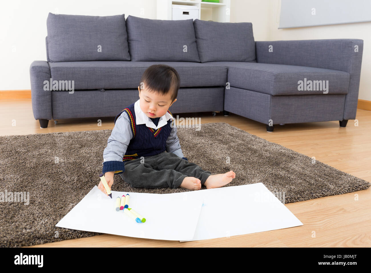 Asian baby boy drawing at home Stock Photo - Alamy