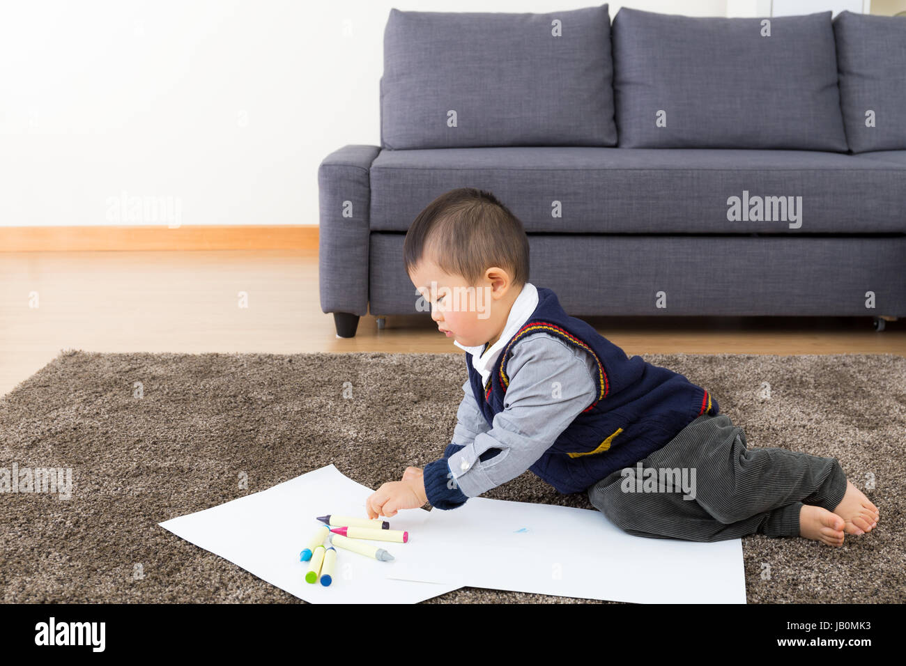 Asian baby boy drawing at home Stock Photo - Alamy