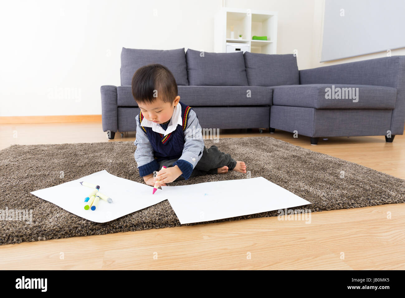 Asian baby boy drawing picture at home Stock Photo - Alamy