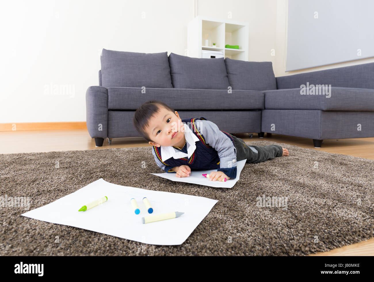 Asian baby boy drawing picture at home Stock Photo - Alamy
