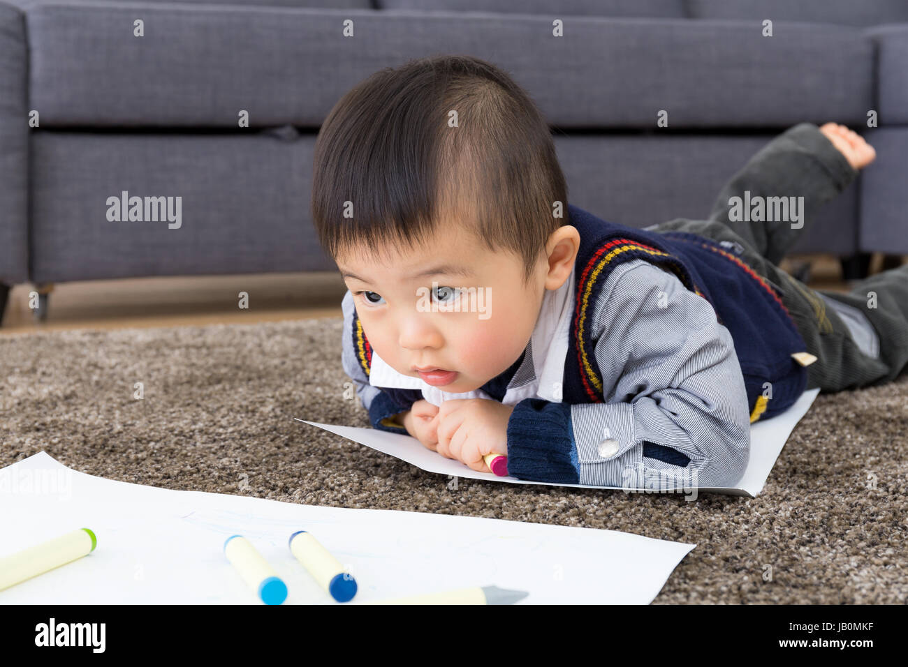 Little boy crawling for drawing Stock Photo - Alamy