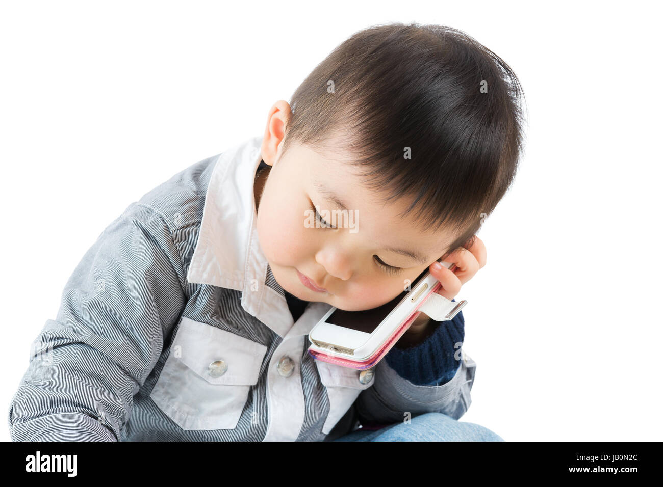 Asian little boy listen to phone Stock Photo - Alamy
