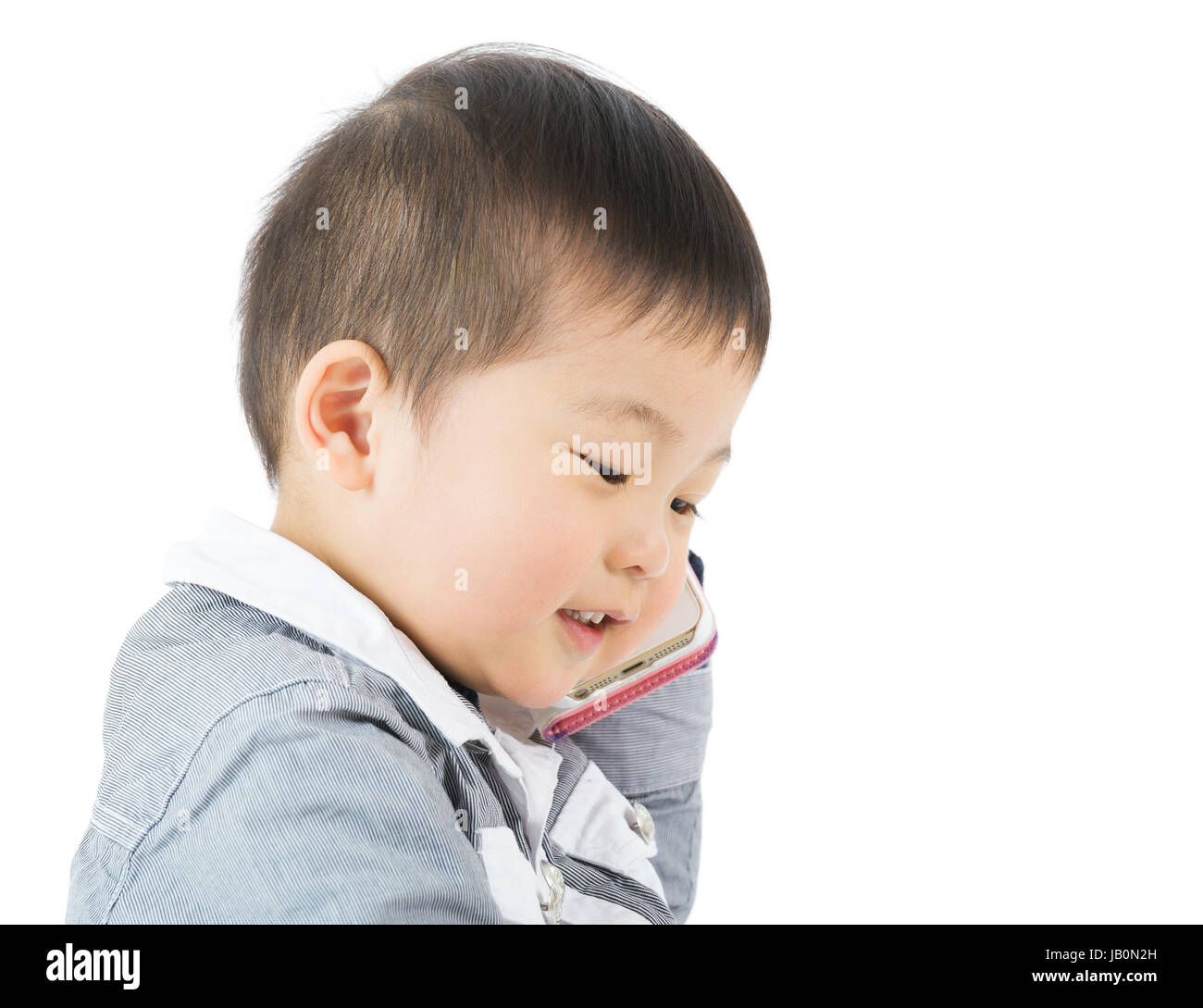Asian little boy chatting by mobile Stock Photo - Alamy