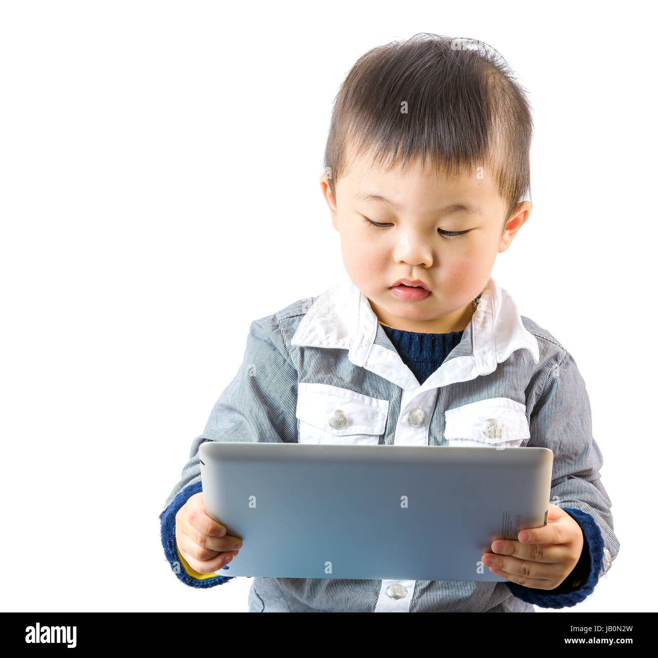 Asian kid using tablet Stock Photo - Alamy