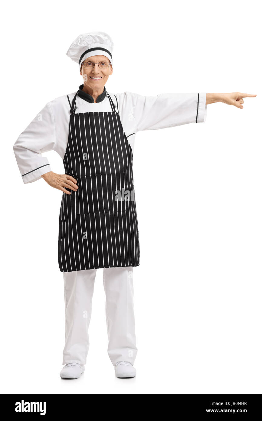 Full length portrait of a chef pointing right isolated on white ...