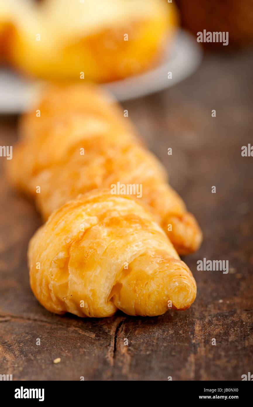 fresh croissant french brioche over old wood table Stock Photo - Alamy