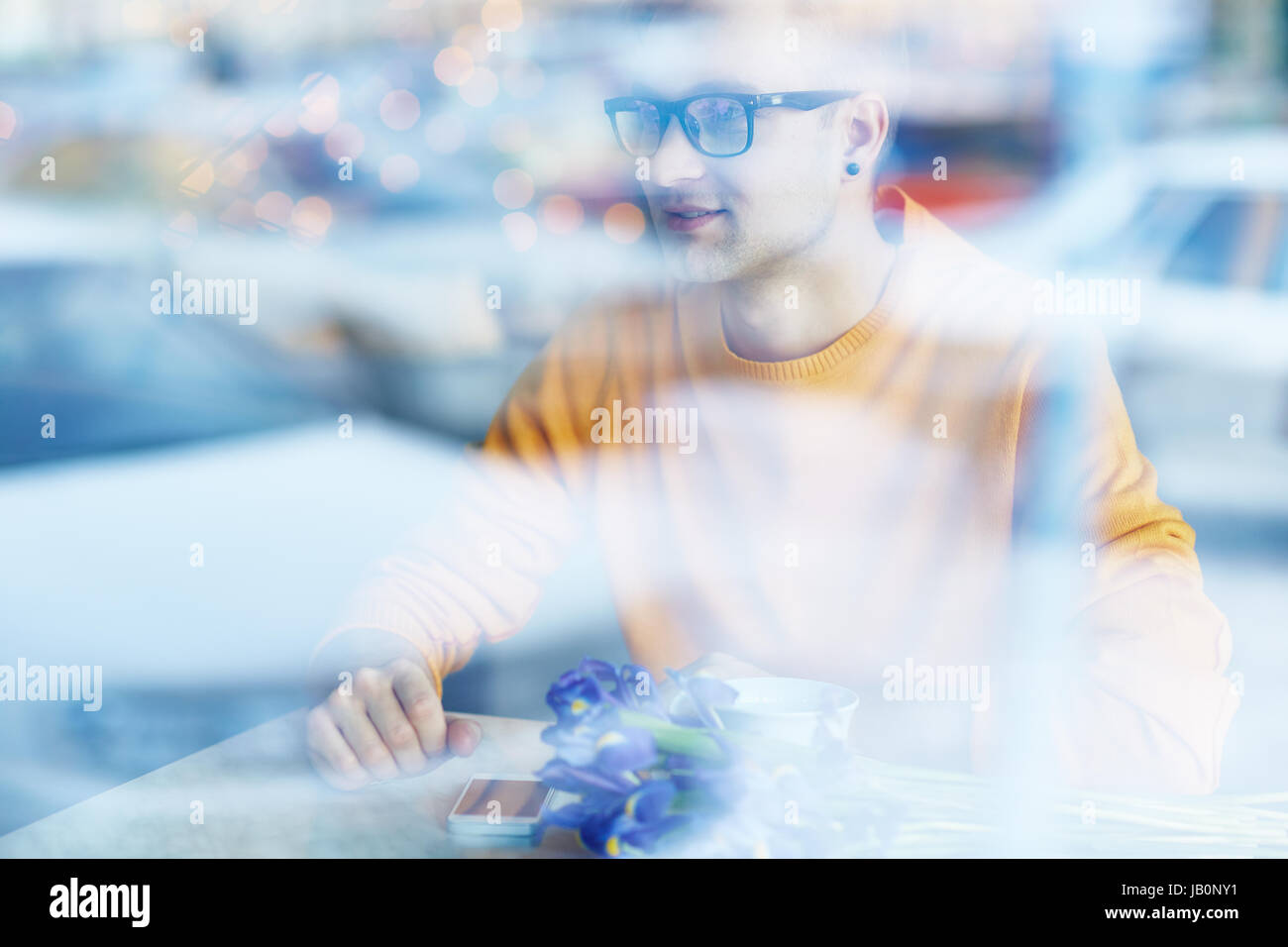 Young Man at Cafe Table on Romantic Date Stock Photo - Alamy