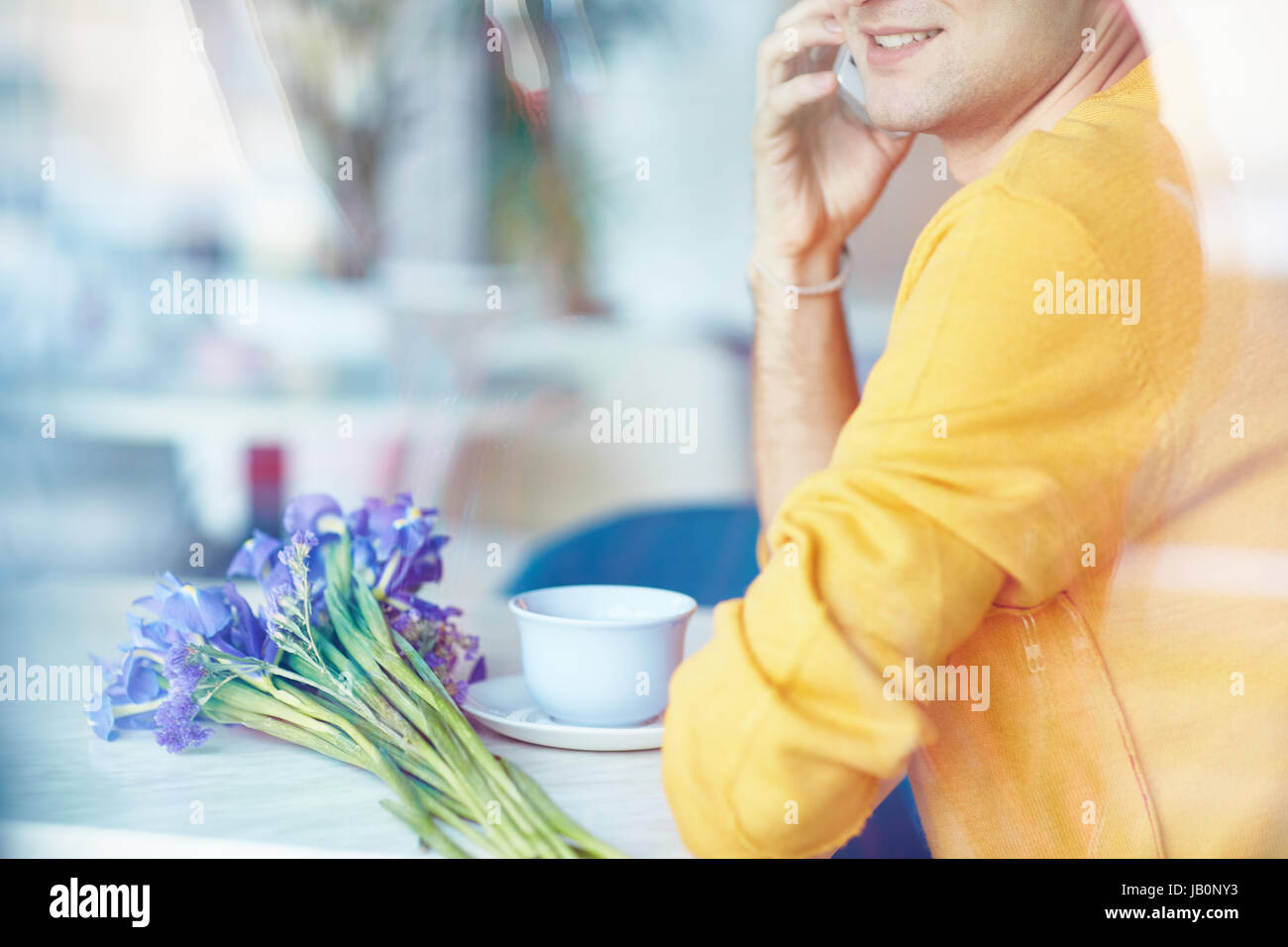 Young Man Calling Girlfriend From Cafe Stock Photo - Alamy