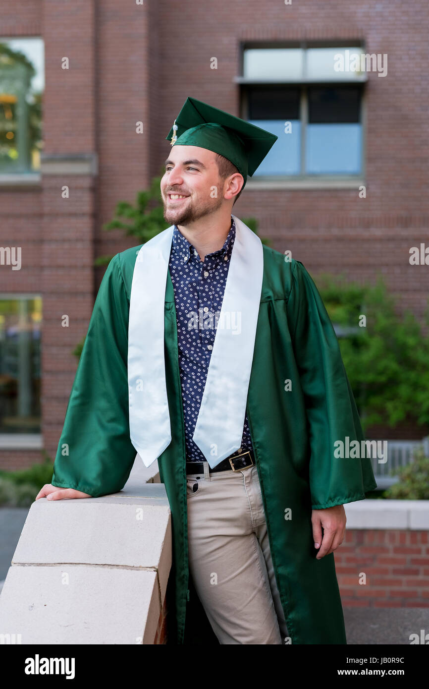 College student graduation lifestyle portrait on campus at a university ...