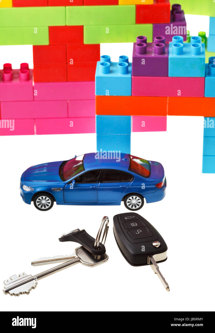 door key, vehicle keys close up, blue model car and plastic block house ...
