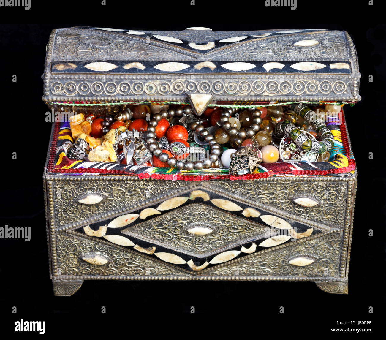 ancient east treasure chest with antique jewelry isolated on black ...