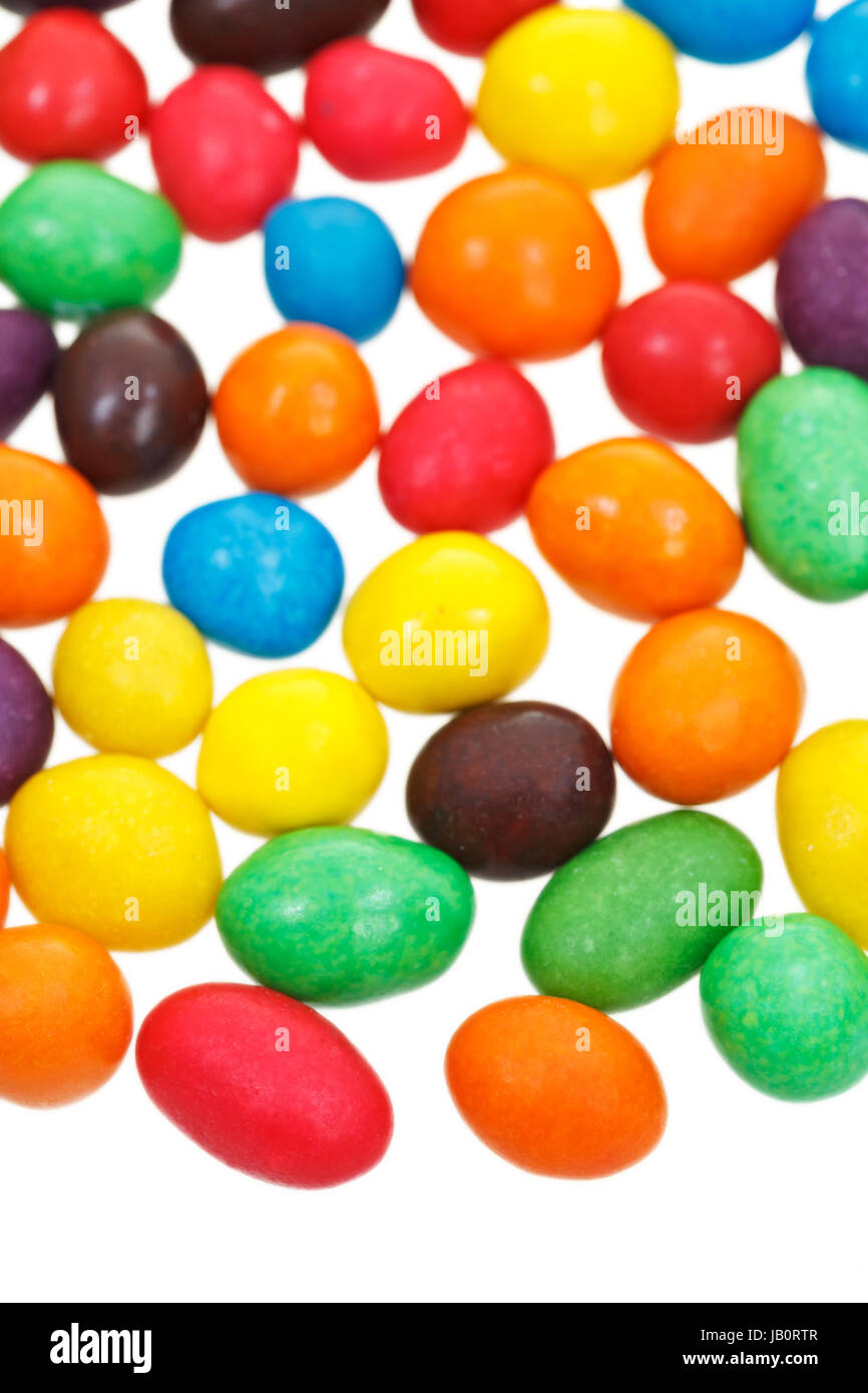 multi-colored chocolate candy dragees close up isolated on white ...