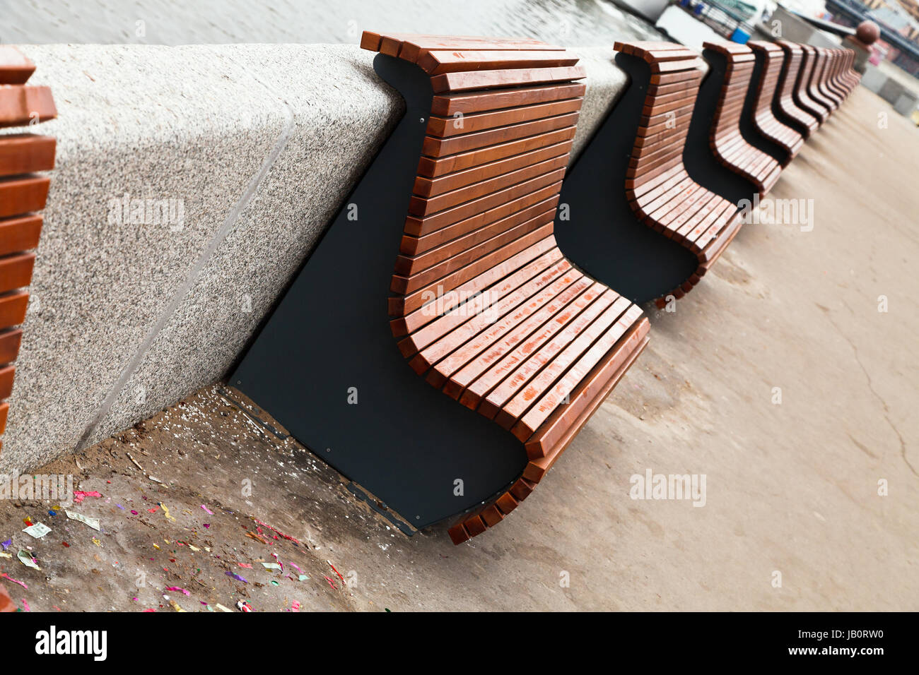 empty wooden benches on river embankment Stock Photo - Alamy