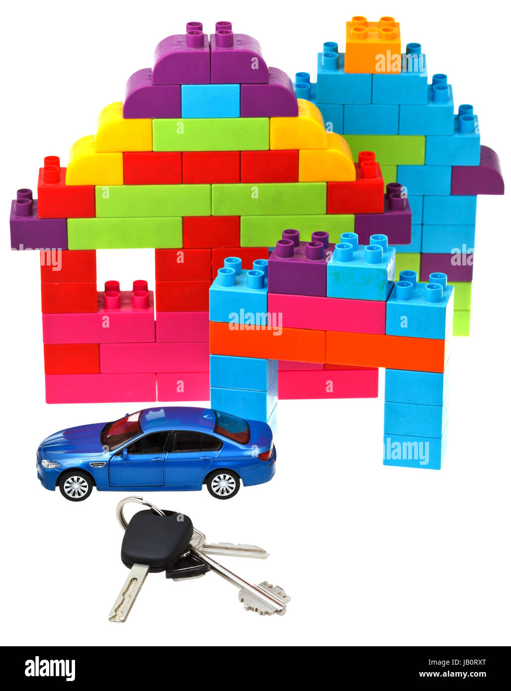 plastic block house and door and car keys close up, blue model car ...