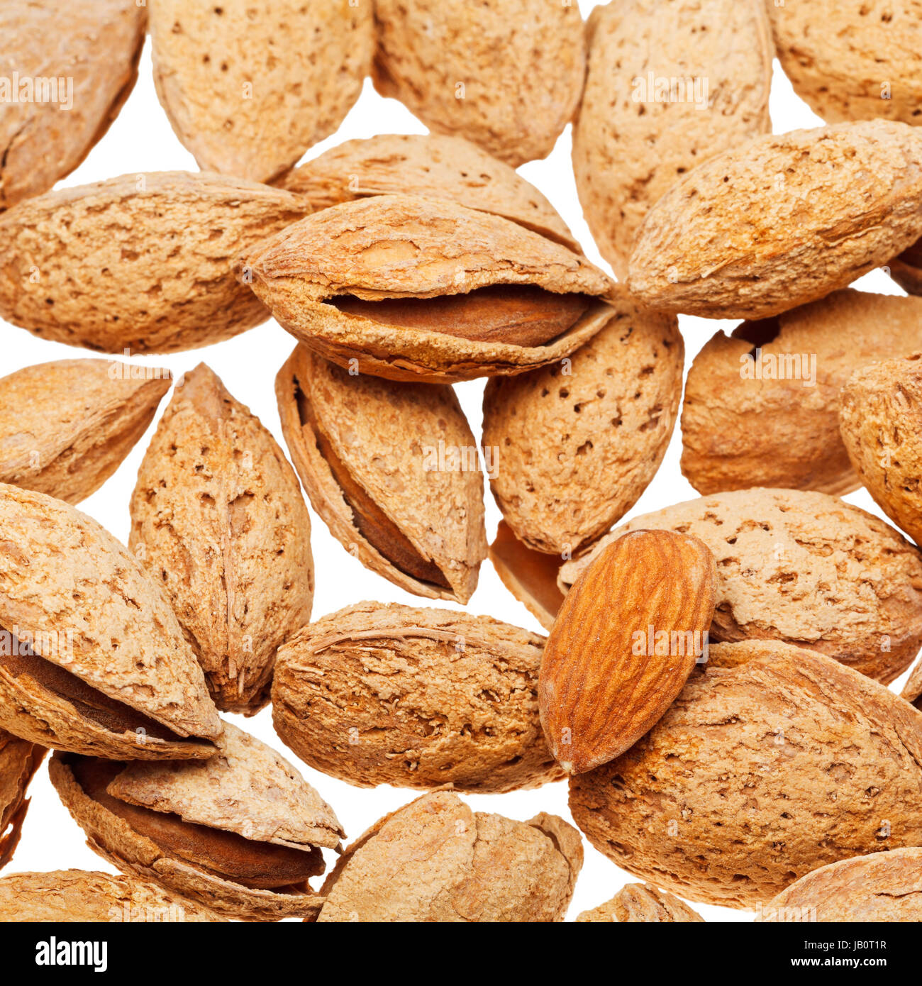 many fried almond nuts isolated on white background Stock Photo - Alamy