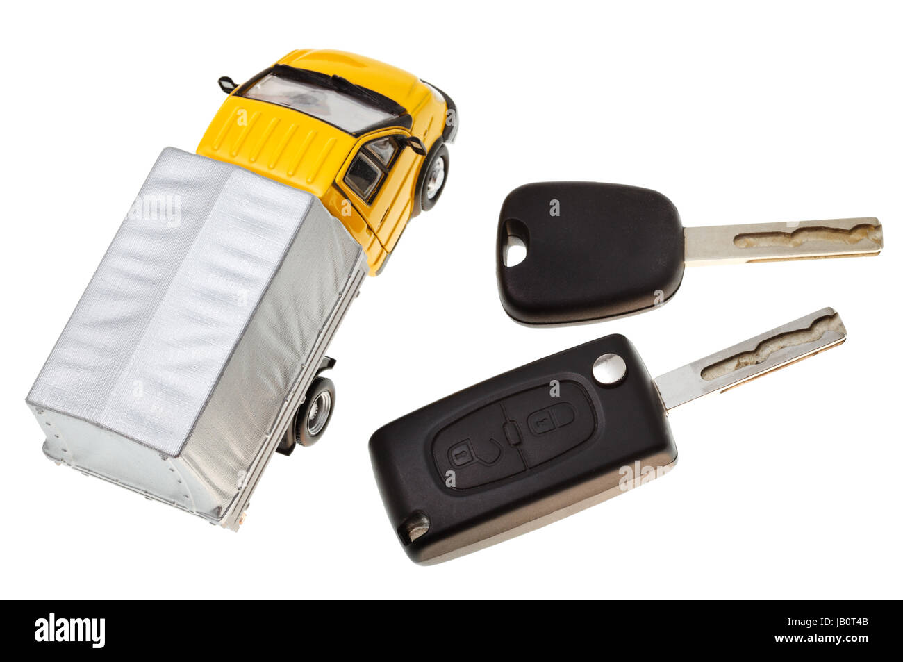 above view of two vehicle keys and truck model isolated on white ...