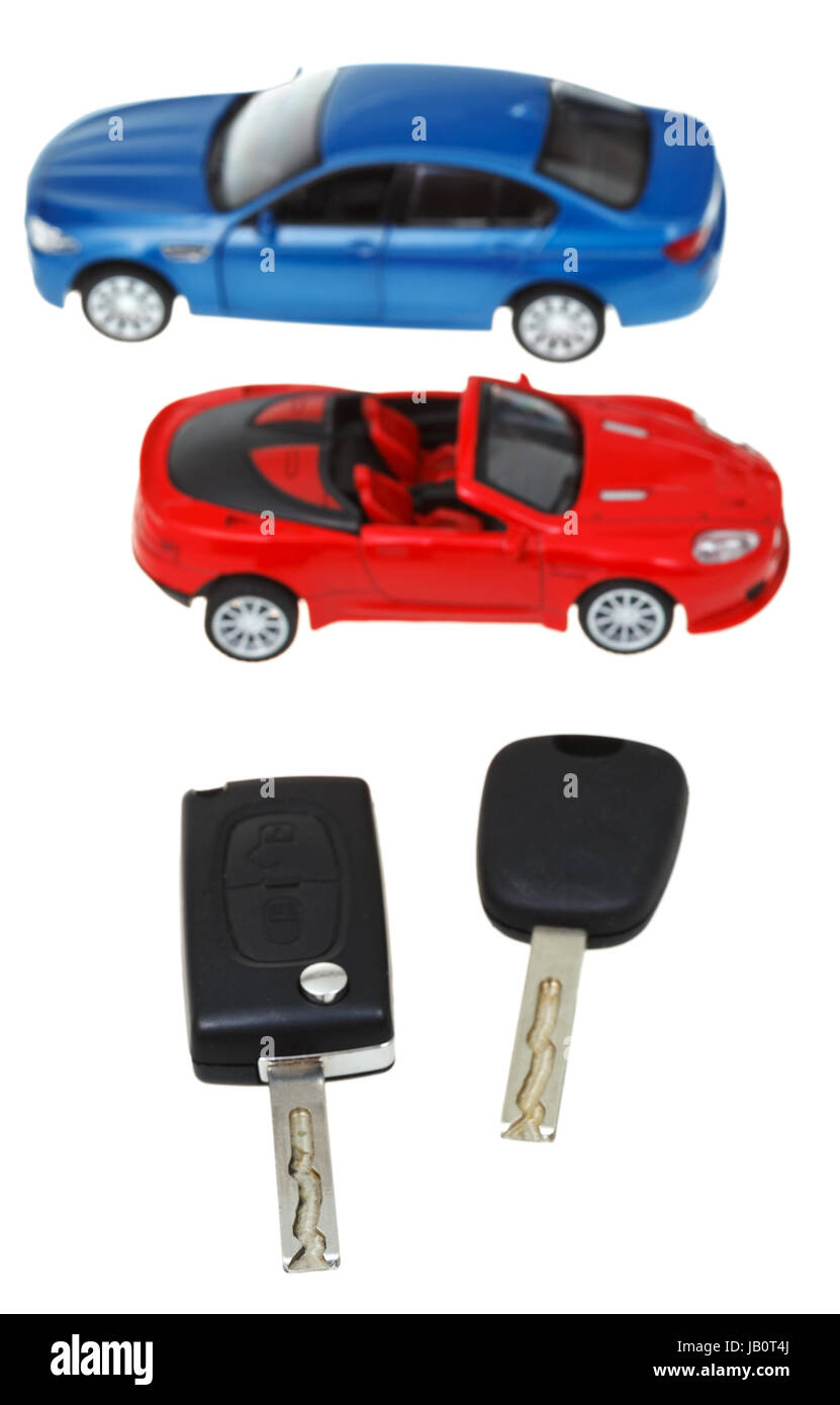 top view two vehicle keys and model cars isolated on white background ...