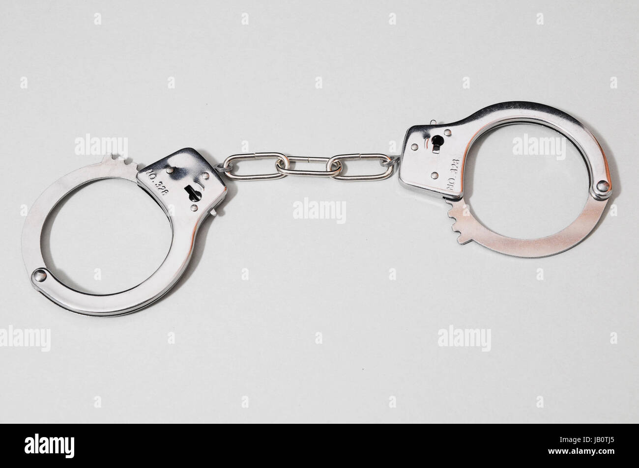 Handcuffing prison hi-res stock photography and images - Alamy