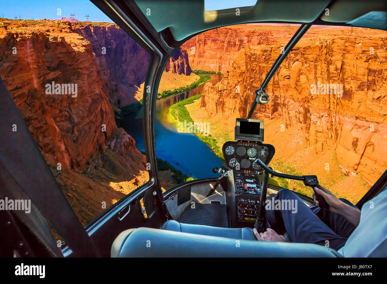Helicopter cockpit with pilot arm and control console inside the cabin ...