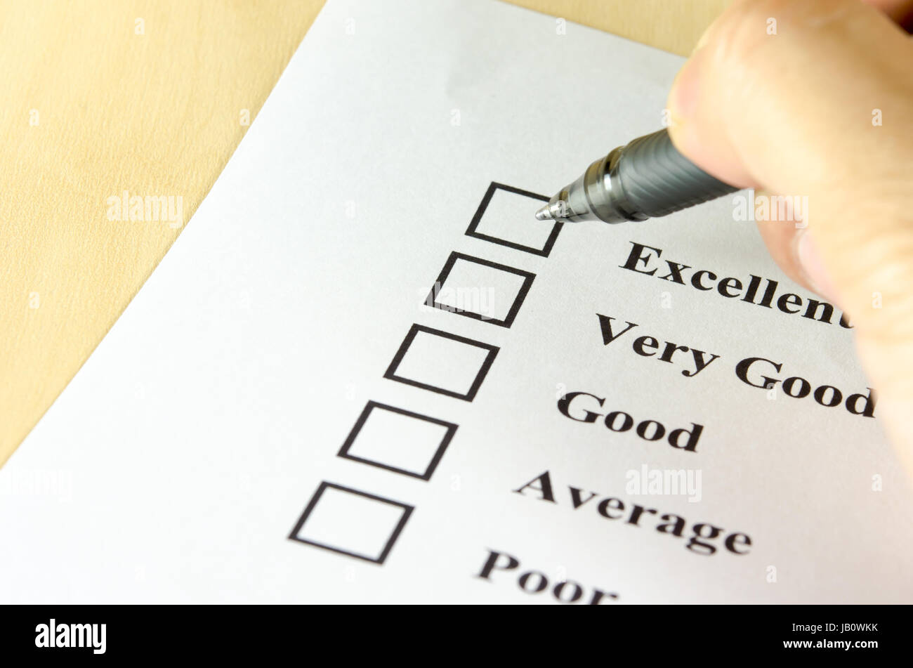 Checklist with pen and checked boxes Stock Photo - Alamy