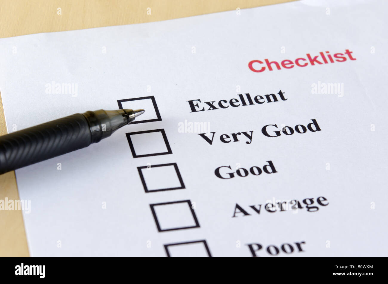 Checklist with pen and checked boxes Stock Photo - Alamy