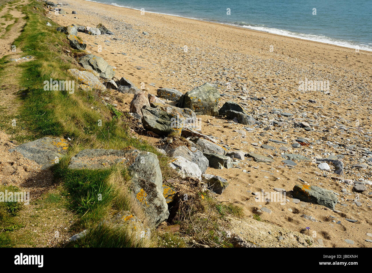 Rocks and footprints in the sand Stock Photo - Alamy
