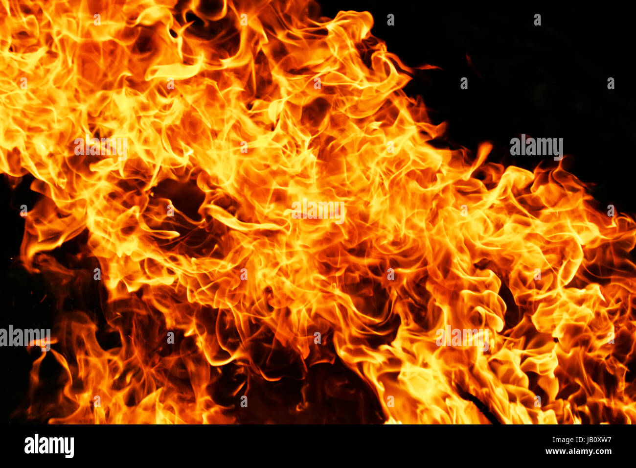 Beautiful yellow and orange hot fire on black background Stock Photo ...