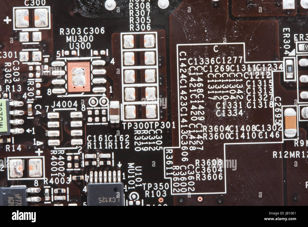 Close-up photo of electronic circuit board with integrated microchips ...