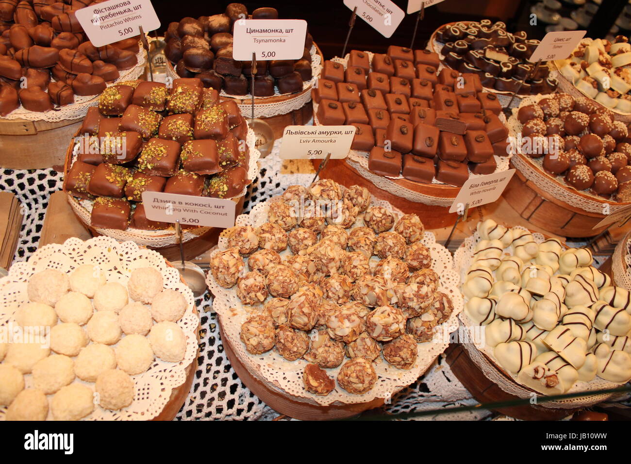 different and delicious confectionery in the shopwindow Stock Photo - Alamy
