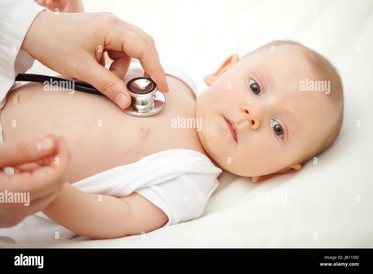 baby portrait and pediatrician check Stock Photo - Alamy