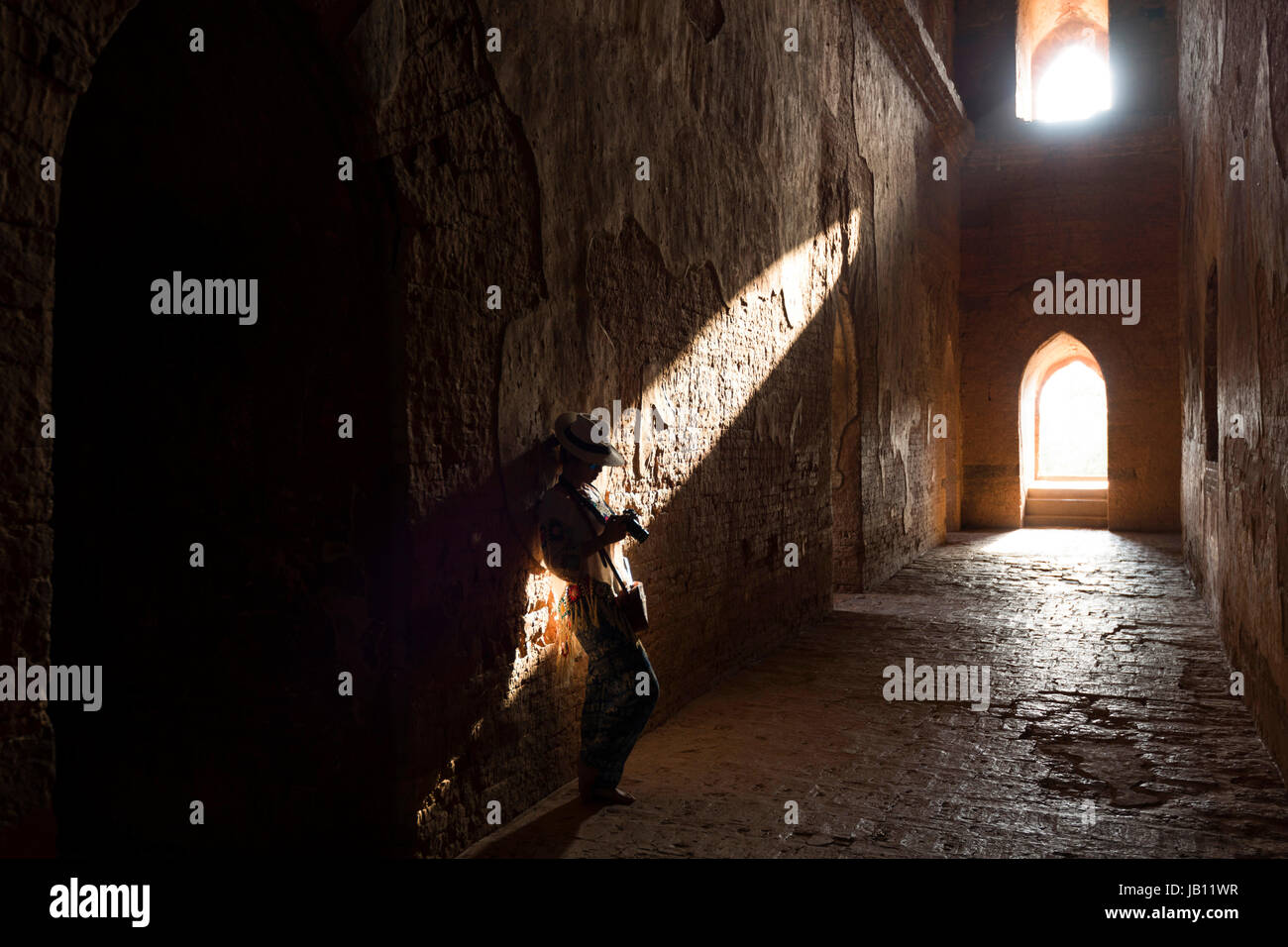 Woman inside Dhammayangyi Pagoda, an ancient temple in Bagan, Myanmar ...
