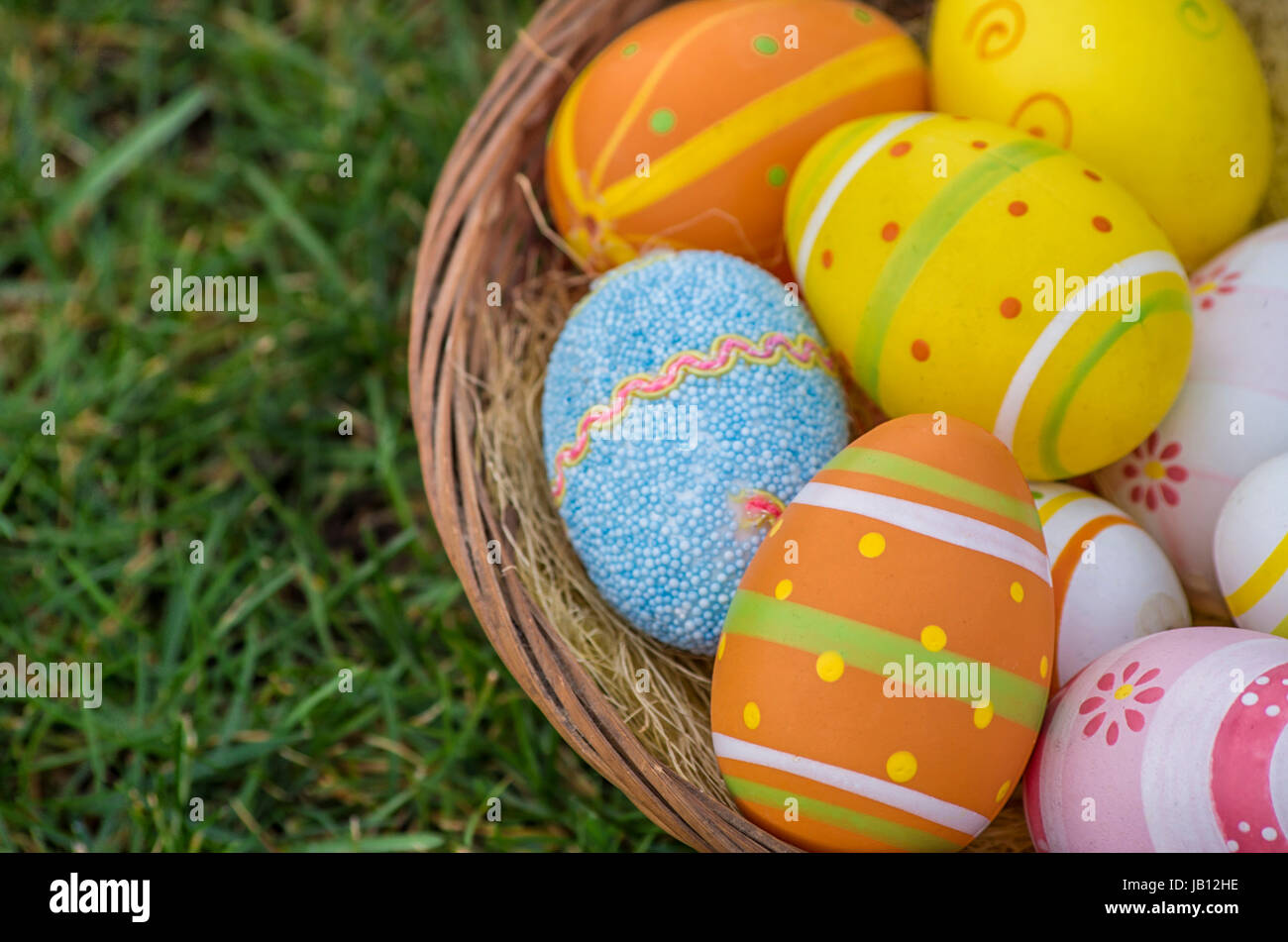 Easter eggs in grass with great colors Stock Photo - Alamy