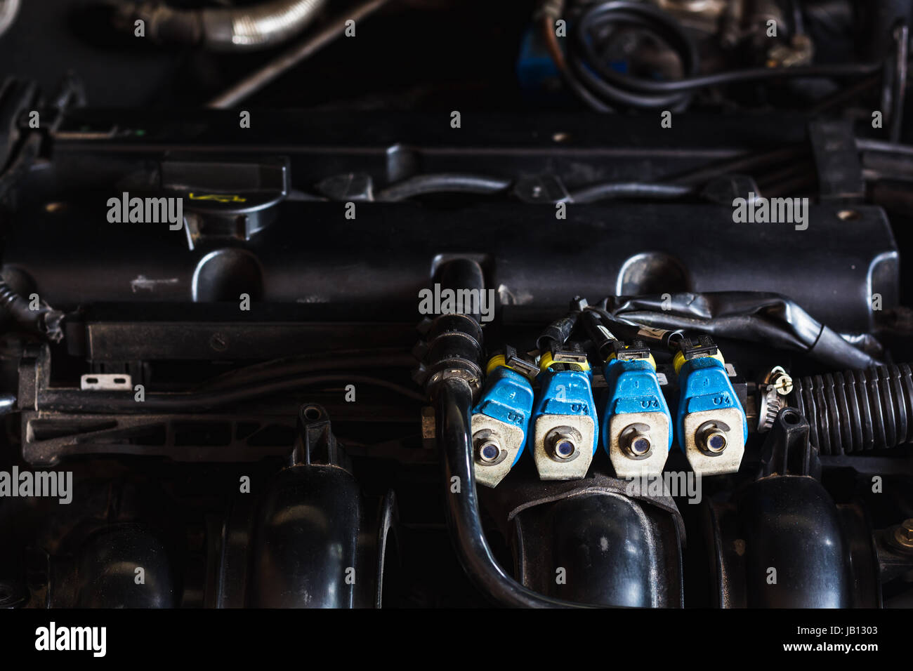 blue color LPG fuel injection focus in engine room Stock Photo - Alamy